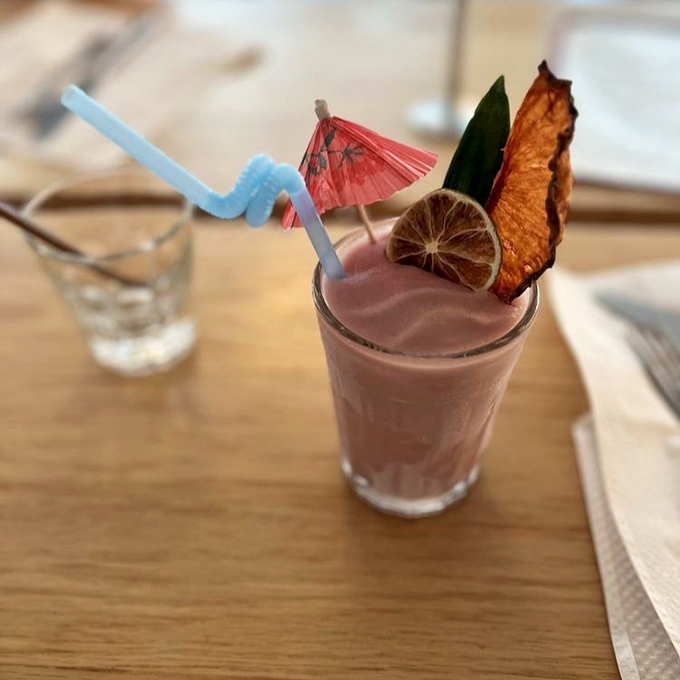 Who needs boring beverages when you can sip this tropical vacation in a glass? The paper umbrella isn't just cute—it's mandatory for full enjoyment.