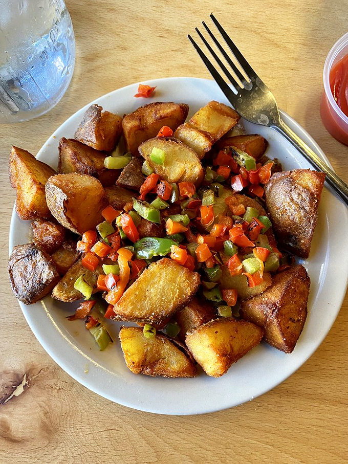 These aren't just breakfast potatoes—they're little golden nuggets of morning joy, dressed up with peppers that add both color and kick to your day.