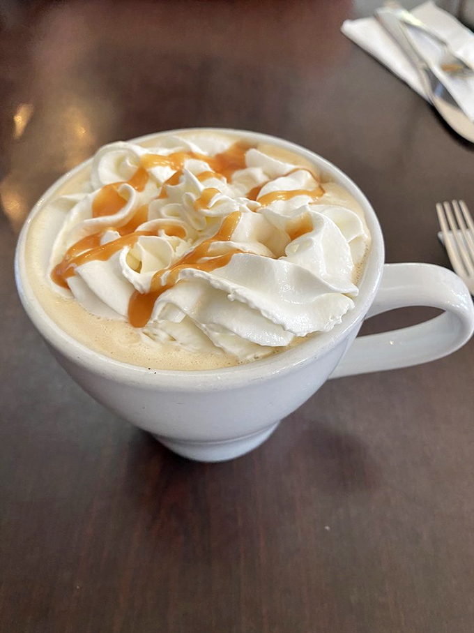 This caramel-crowned coffee creation isn't just a beverage—it's dessert with caffeine, a morning indulgence that makes alarm clocks worthwhile.