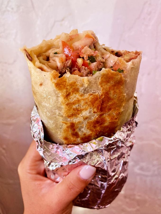 Standing tall and proud, this burrito demands respect. The golden-brown crust from the grill gives way to a perfect medley of carnitas and fresh ingredients.