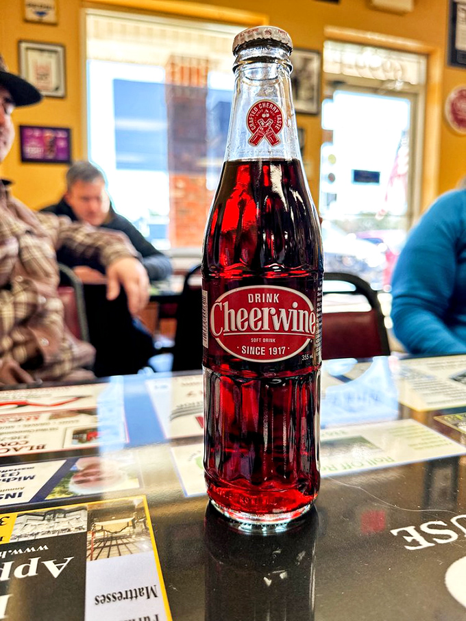 A bottle of Cheerwine—the ruby-red Carolina classic that makes cola seem boring. Pairs with burgers like Fred with Ginger.