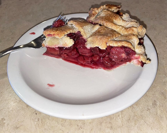 This cherry pie doesn't just have filling—it has attitude, with that perfect balance of sweet-tart cherries and a crust that flakes with buttery abandon.