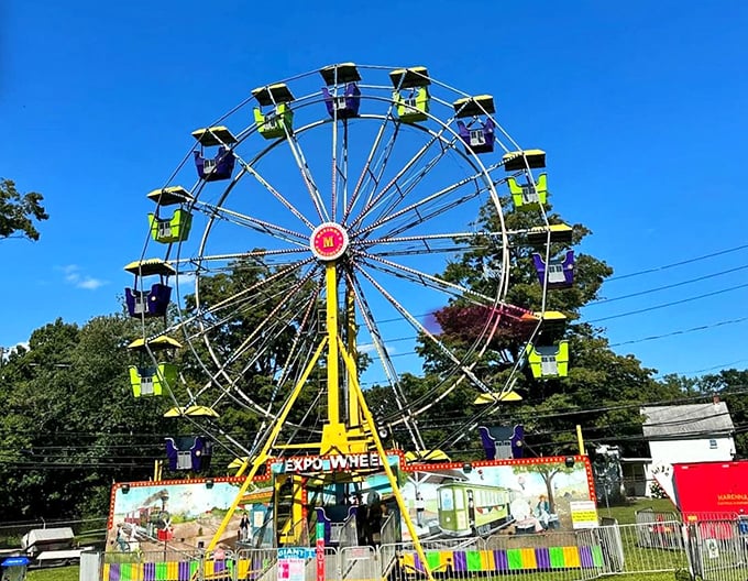 The Chester Fair's Ferris wheel against a Connecticut blue sky – proof that simple pleasures never go out of style, especially when bathed in sunshine.