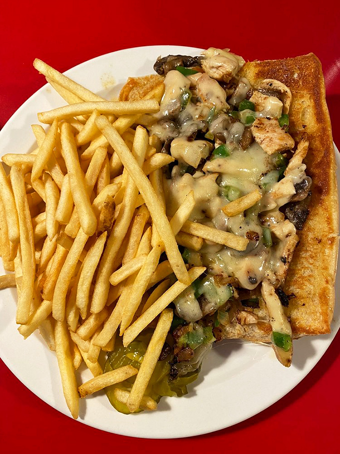 The Chicken Philly brings Pennsylvania pride to Nebraska plates. Those perfectly sautéed peppers and mushrooms nestled against melted cheese are pure sandwich poetry.