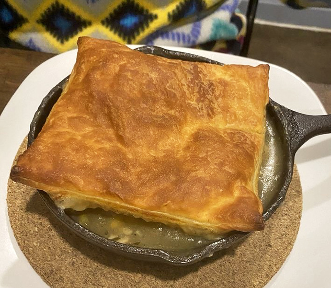 This isn't just chicken pot pie—it's comfort encased in golden pastry. The steam escaping when you break that crust is practically aromatherapy.