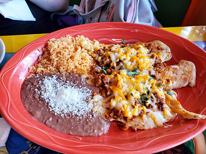 This plate doesn't just serve food—it tells a story of comfort, with melted cheese blanketing everything like a warm hug for your taste buds.