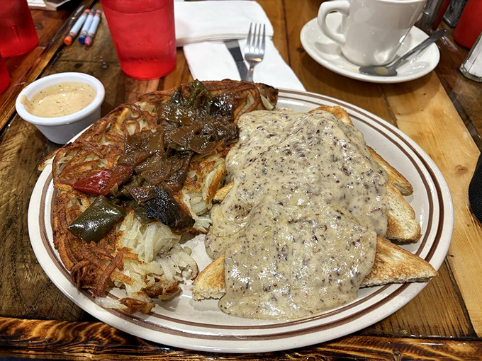 Chipped beef on hash browns—the breakfast that sustained a generation. This plate demonstrates why some classics never need reinvention.