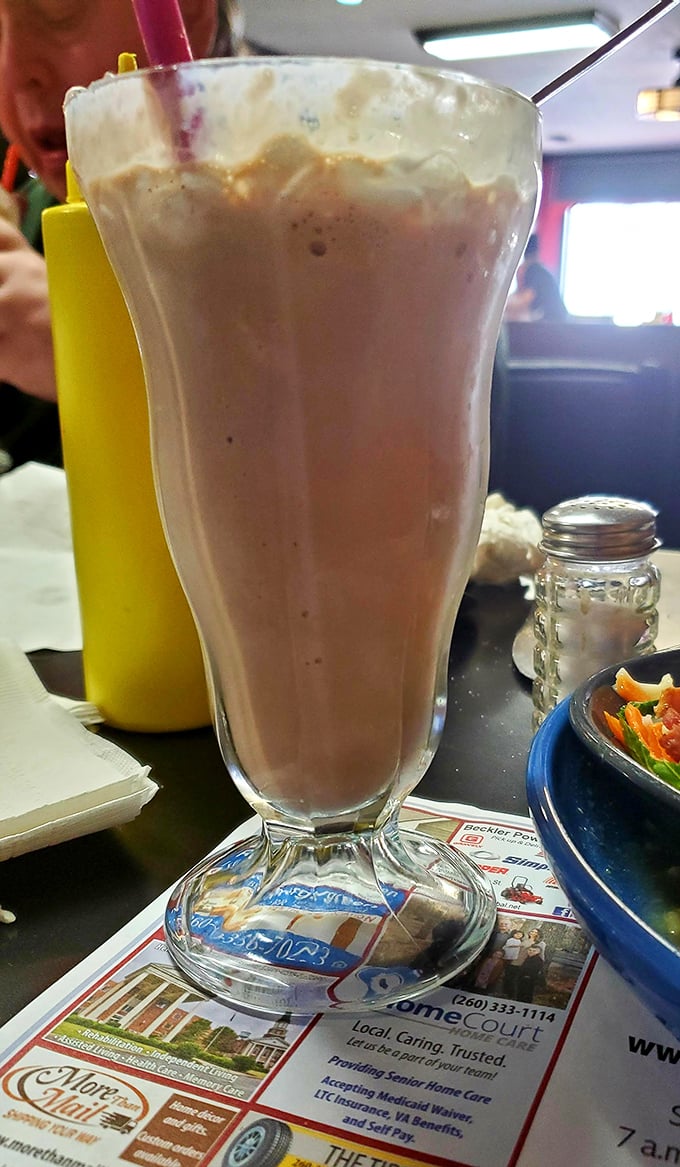 Not just a milkshake but a time machine in a glass—thick, creamy nostalgia that demands to be savored through a straw.