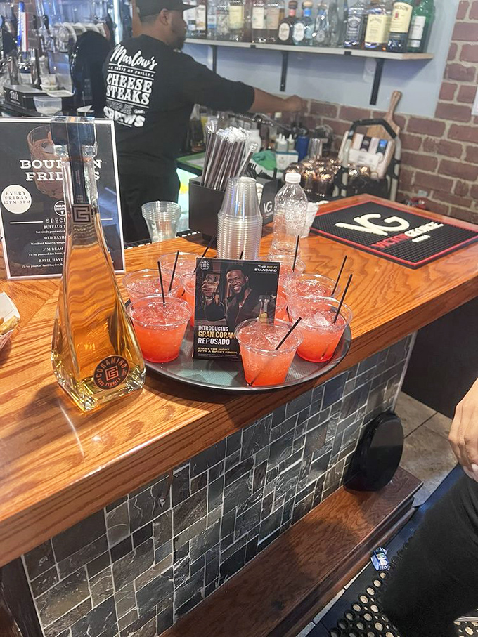 These cocktails aren't just drinks—they're liquid accessories for your cheesesteak adventure. That vibrant red says "weekend" in any language.