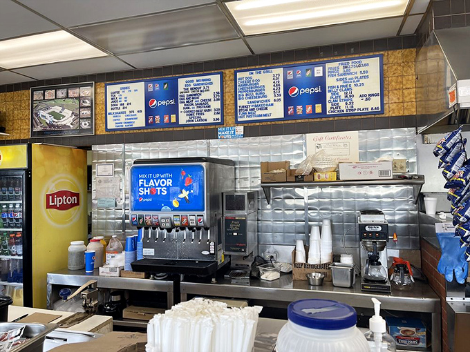 The beverage station – where coffee that actually tastes like coffee meets fountain drinks that haven't changed their formula since your childhood.
