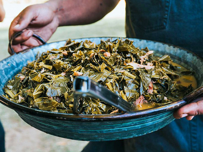 Collard greens that have clearly lived their best life—swimming in potlikker that contains more soul than a Motown greatest hits compilation.
