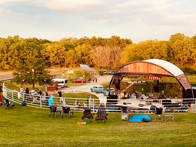Summer concerts under open skies—where the music mingles with fireflies and the audience brings their own chairs and shared history.