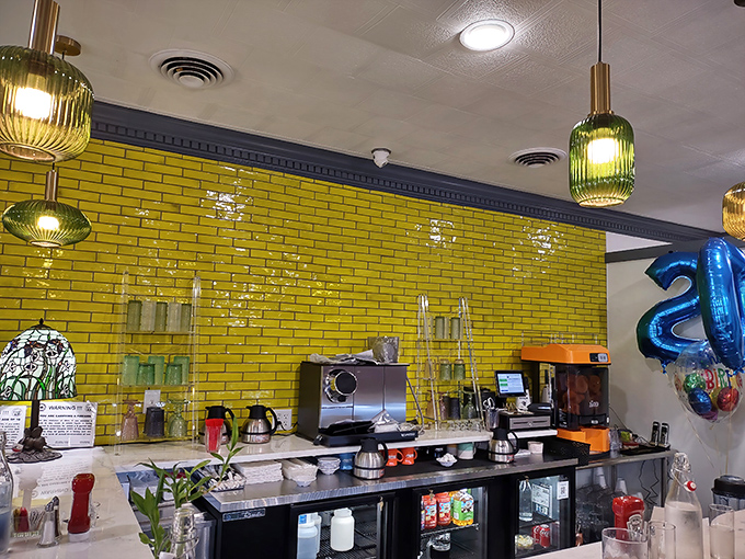 Behind that brilliant yellow tile backsplash, breakfast magic happens—the coffee station standing ready like morning's command center.