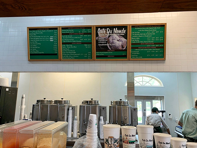 Behind these counters, the simple magic happens. No molecular gastronomy or foam required—just dough, hot oil, and an avalanche of powdered sugar.