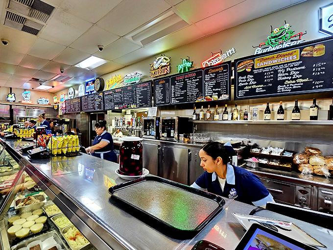 Behind this counter, skilled hands craft sandwiches that have become legendary throughout the city. 