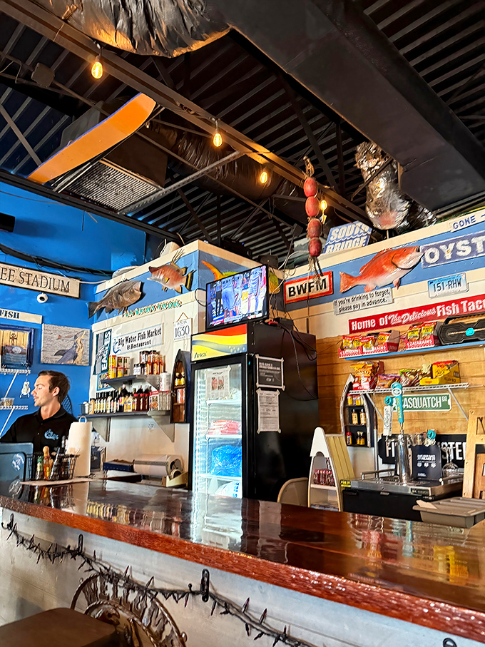 The counter where seafood dreams come true. Those mounted fish on the walls aren't just decoration – they're inspiration for what might end up on your plate. 