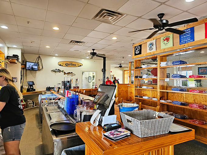 Behind every great seafood joint is a counter where magic happens. The Corona surfboard isn't just decoration—it's a lifestyle statement.