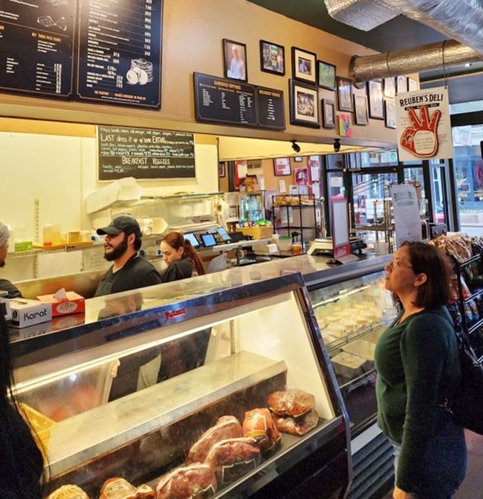 Behind the counter is where the magic happens—skilled hands transforming simple ingredients into edible masterpieces while customers watch in awe.