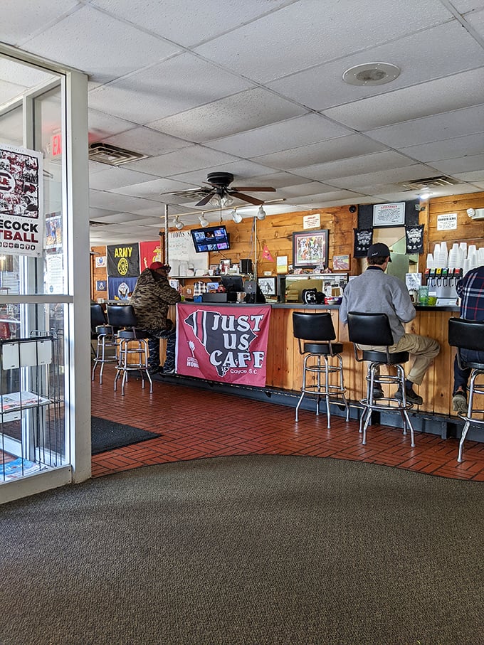 The counter—where solo diners find community, regulars claim their territory, and newcomers become part of the Just Us family story.