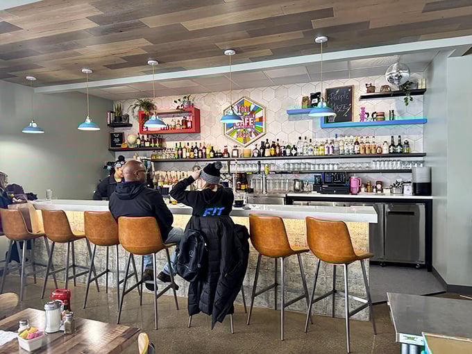 The bar seating offers front-row tickets to the culinary show, perfect for solo diners or those who appreciate the rhythm of a working kitchen.