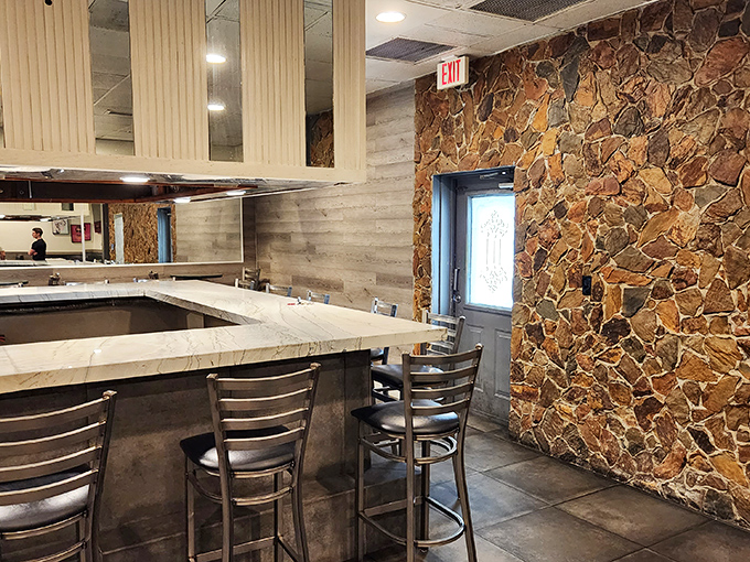 Stone wall meets marble counter—surprisingly elegant touches in this unpretentious eatery. Pull up a stool and stay awhile.