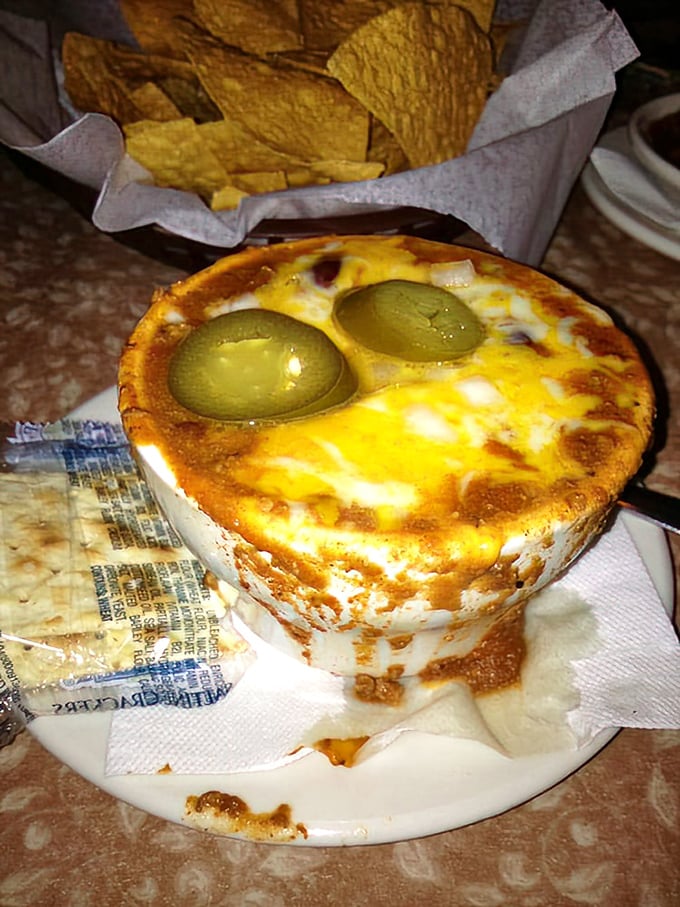 Those green olives peeking out from melted cheese like they're playing hide-and-seek—a savory surprise in every spoonful.