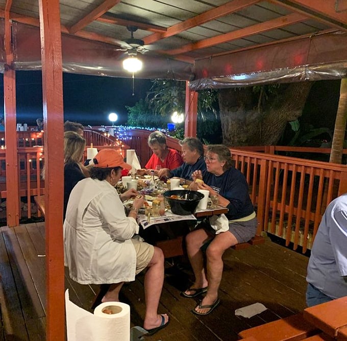 The outdoor deck at sunset is where seafood memories are made – casual dining with serious flavors under Florida skies.