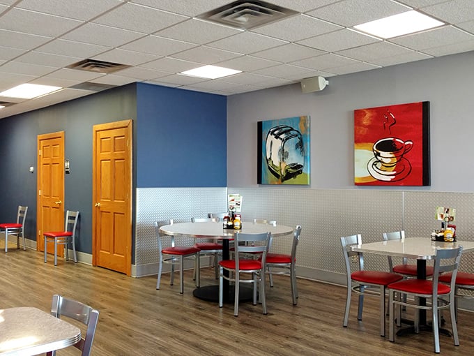 Blue walls, vibrant art, and pops of red create the perfect backdrop for morning conversations that range from weather updates to life-changing decisions.