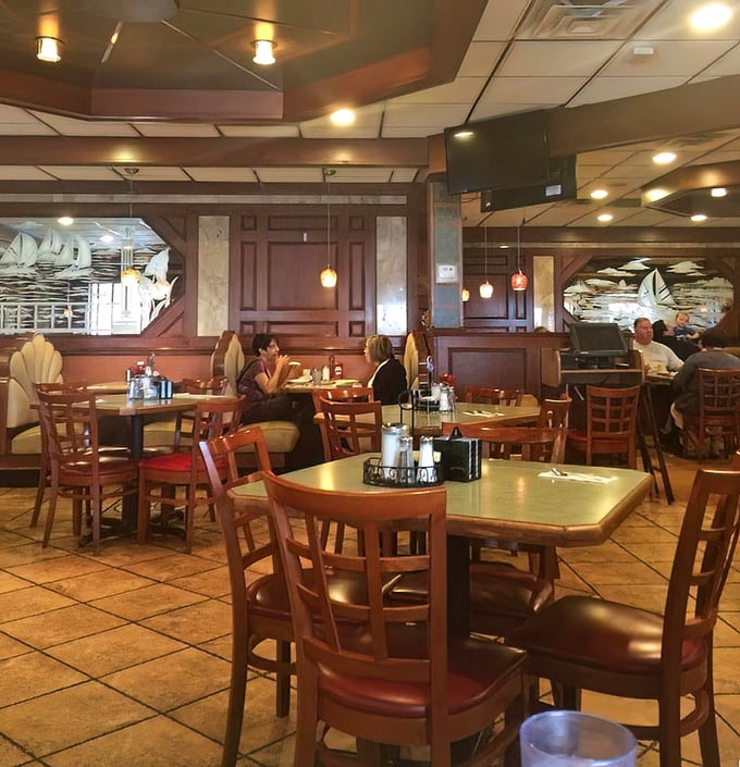 The dining room hums with conversation and silverware clinks – the soundtrack of contentment playing beneath pendant lights and waterfowl etchings.