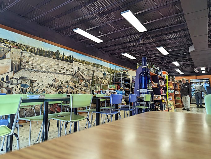 The dining area offers front-row seats to the Jerusalem mural—dinner and a show, minus the overpriced tickets and uncomfortable theater seats.