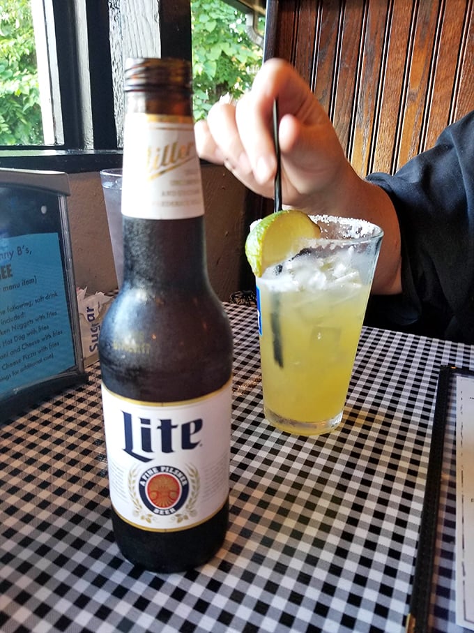 A cold beer and a margarita with salt-rimmed promise—the universal signal that vacation mode has officially begun, even on a Tuesday.