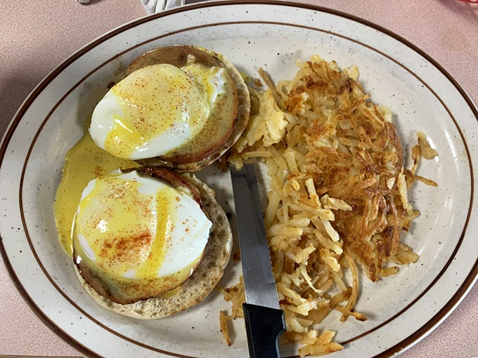 Eggs Benedict done right—those perfectly poached eggs look like they're wearing little hollandaise jackets for a fancy breakfast party.