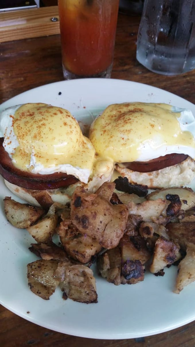 Eggs Benedict with hollandaise so good you'll want to write home about it, alongside potatoes that didn't cut corners.