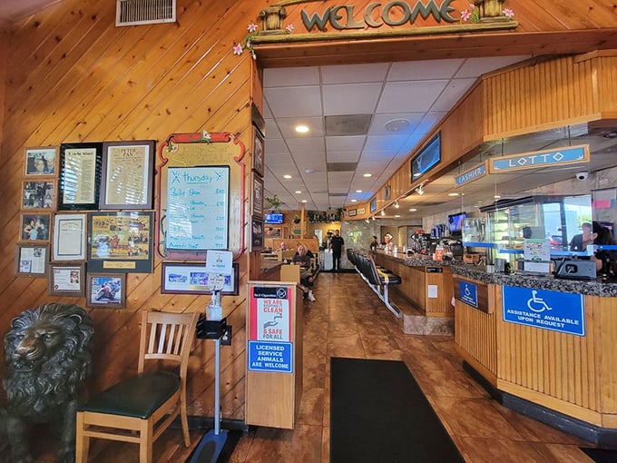 The entrance says "Welcome" in both signage and spirit. Wood paneling and warm lighting set the stage for the comfort food performance to come.