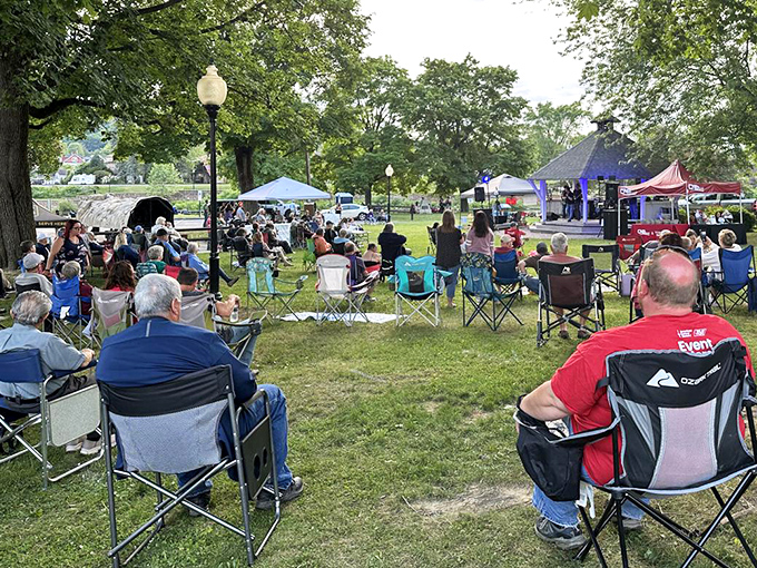 Community gatherings in riverside parks create the kind of connections that make small towns feel like home.