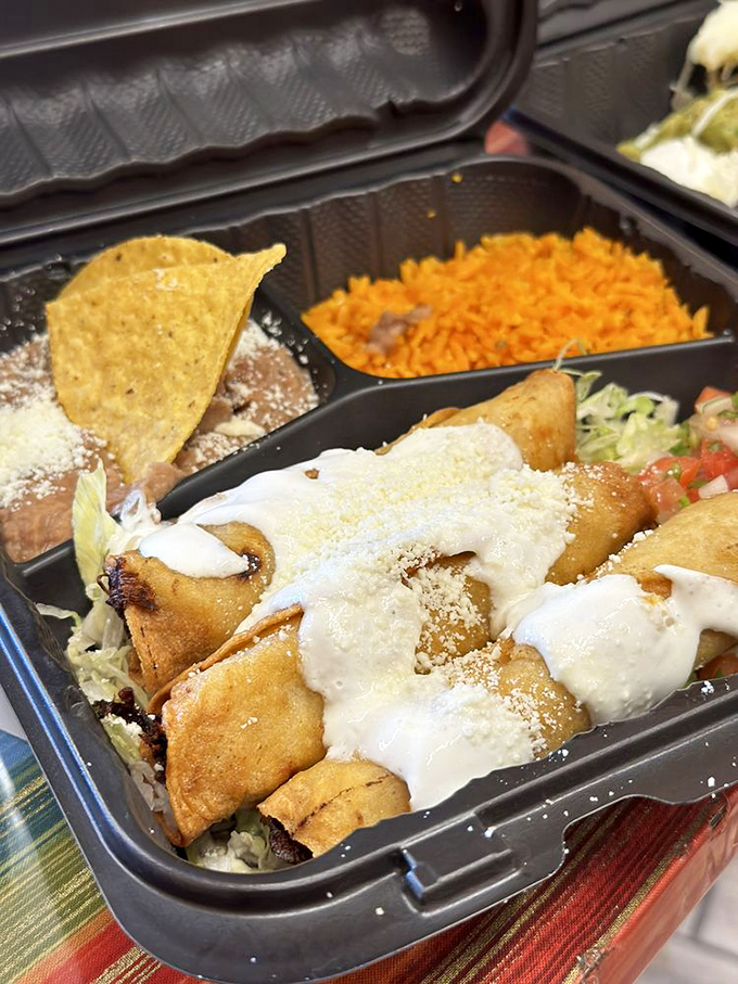 Flautas standing at attention, crispy soldiers ready for duty. The crunch is audible three tables away—and worth every decibel.