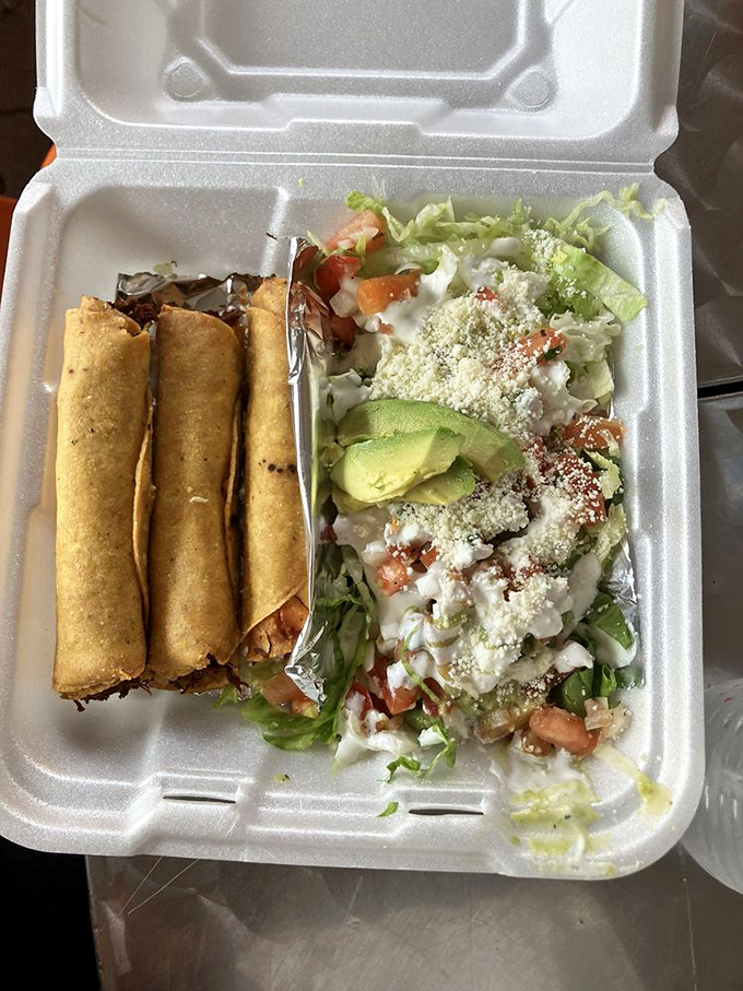 Flautas lined up like delicious soldiers, ready to battle hunger with their crispy exteriors and savory fillings. The fresh salad provides perfect balance.