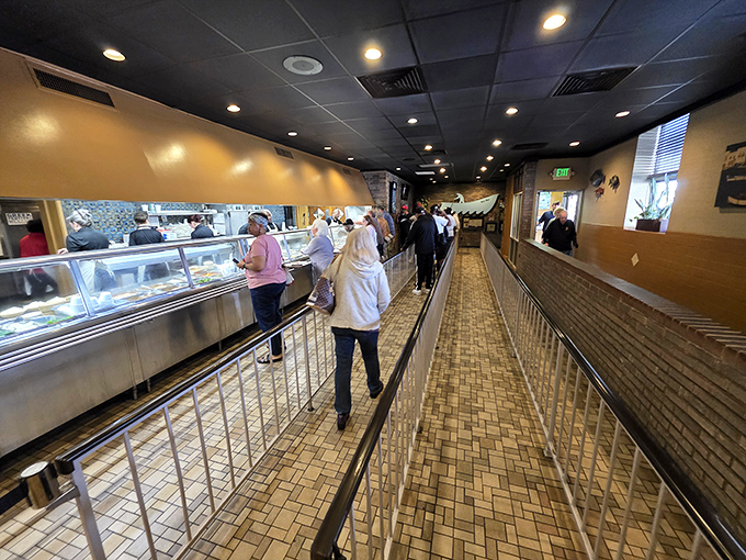 The legendary cafeteria line at Niki's West moves with military precision—choose quickly or face the consequences of holding up hungry Birminghamians.