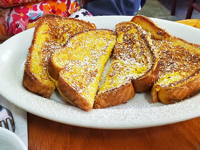 French toast so perfectly golden and powdered, it makes you wonder if the Midas touch applies to breakfast foods too.