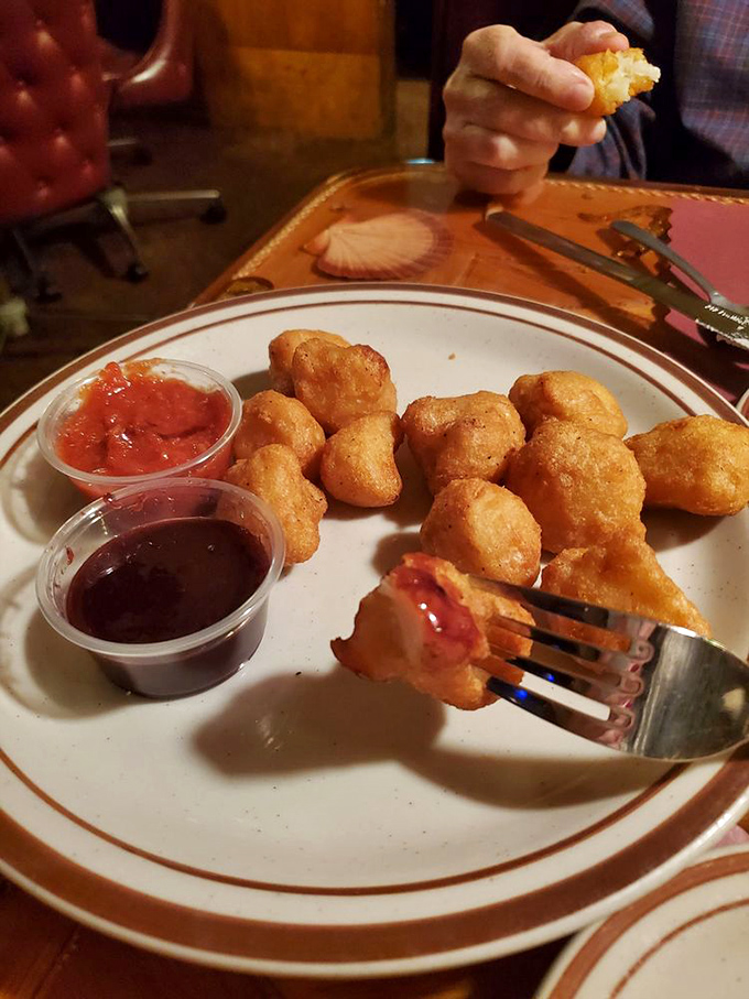 Golden-fried cauliflower bites that make you forget you're technically eating vegetables. That dipping sauce isn't optional—it's mandatory.