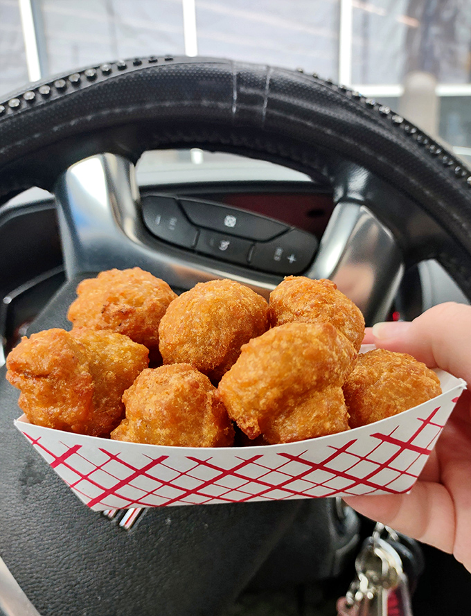 Fried mushroom poppers that look like they're being enjoyed in the comfort of a car—the original dining room of American fast food culture.
