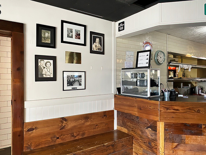The wall of memories tells stories of community while the kitchen beyond promises another chapter of deliciousness is about to begin.