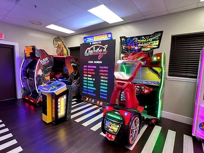 Where quarters disappear and childhood reappears—arcade games providing the perfect sugar-burning activity between treats.