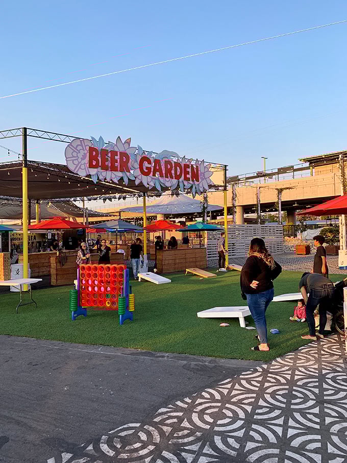 The Beer Garden offers a civilized oasis for weary shoppers—because bargain hunting is technically an Olympic sport deserving of refreshment.