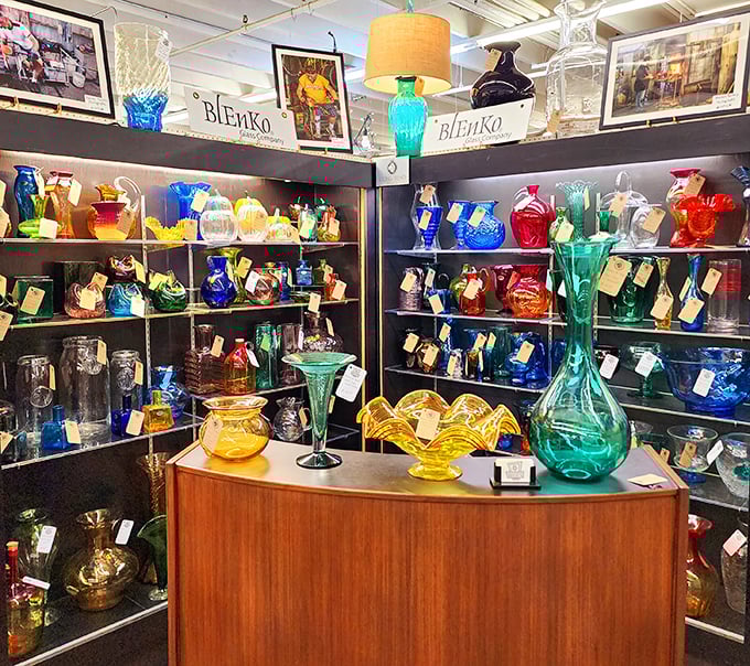 The Blenko glass collection glows like jewels under the lights. These aren't just vases—they're liquid sunshine captured in mid-pour decades ago.