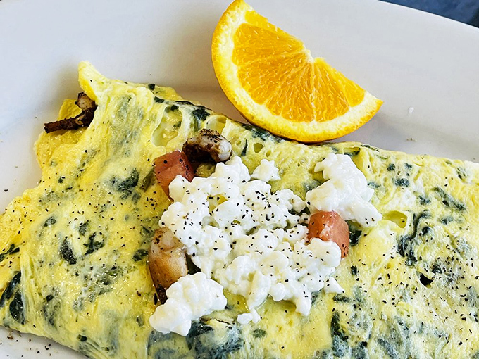 This isn't just an omelet—it's a Mediterranean vacation folded into eggs, with feta providing that perfect tangy counterpoint to the spinach.