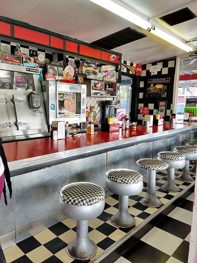 The counter view—where burger magic happens in plain sight. No secrets here, just decades of griddle wisdom and the sizzle of anticipation.