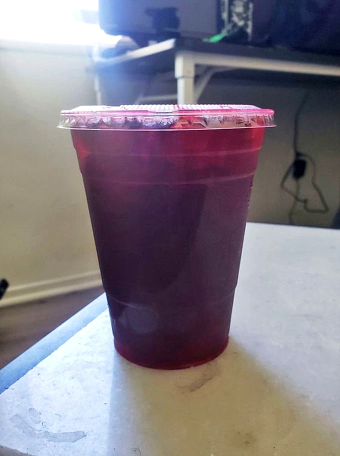 The mysterious purple drink—a sweet interlude between seafood courses that makes your mouth both curious and grateful.