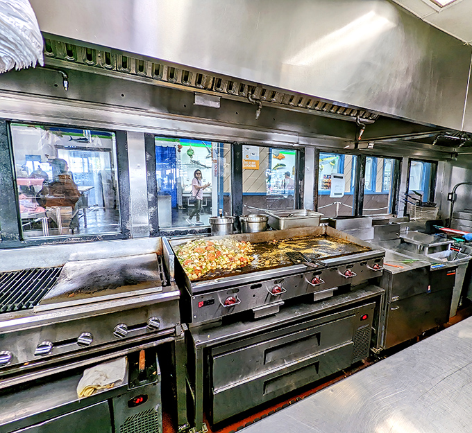 The engine room of flavor. These massive grills have probably seen more seafood than most fishing boats, turning fresh catches into unforgettable meals.