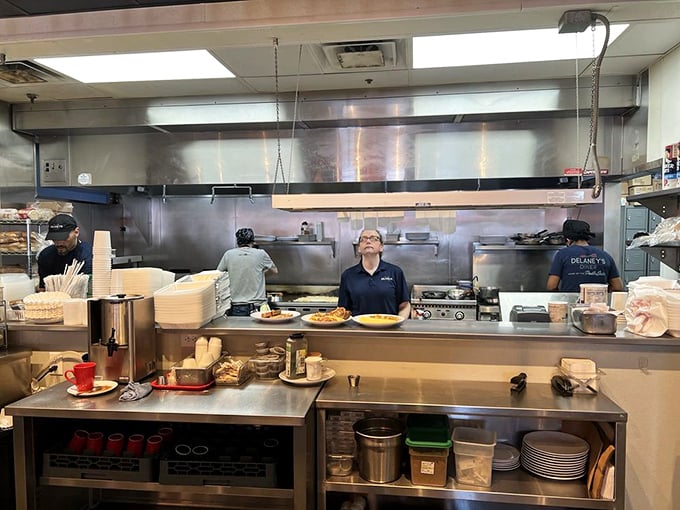 The open kitchen – where breakfast ballet happens daily, with short-order cooks performing culinary choreography for hungry audiences.